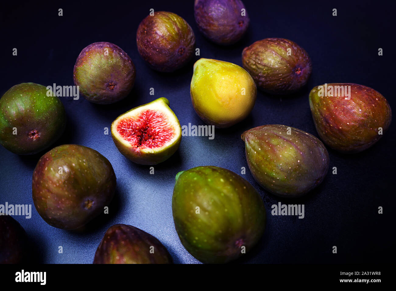 Fresh ripe figs on dark blue black background. Pattern, top view, flat ...