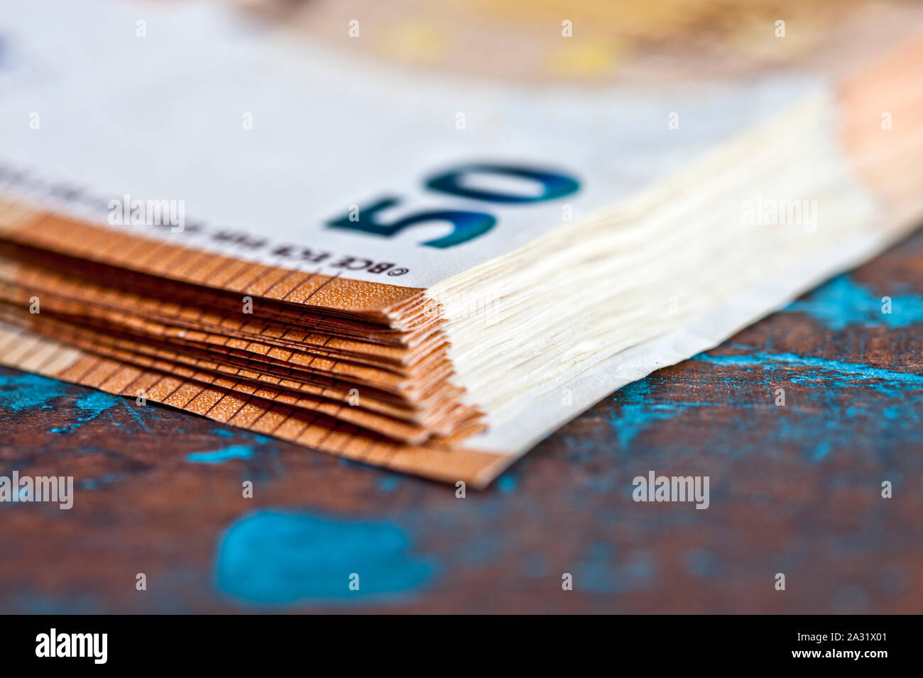 Pile of fifty euro banknotes. Currency bank notes stacked on rustic ...