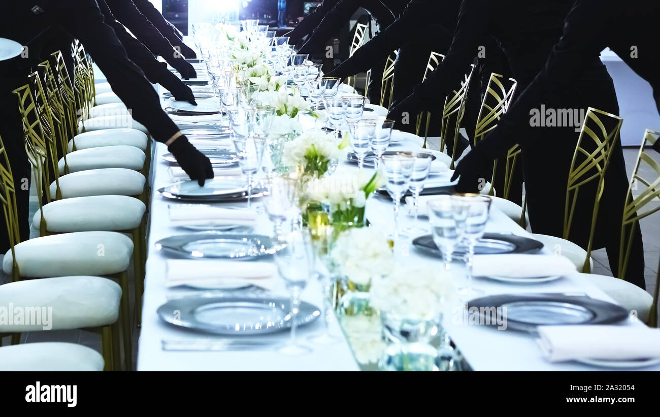 Large group of waiters serving a banquet Stock Photo - Alamy