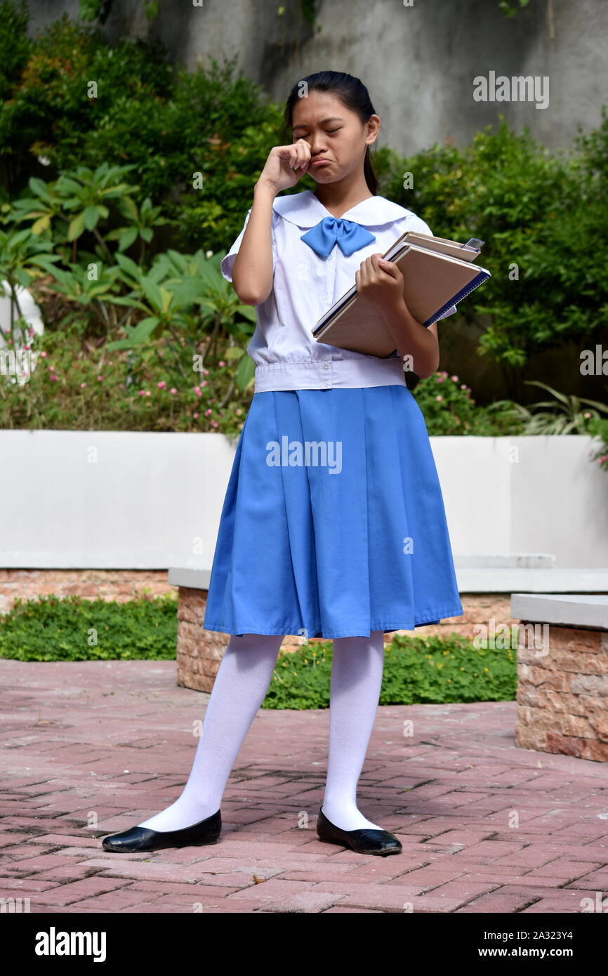 Crying Asian Female Student With School Books Stock Photo - Alamy