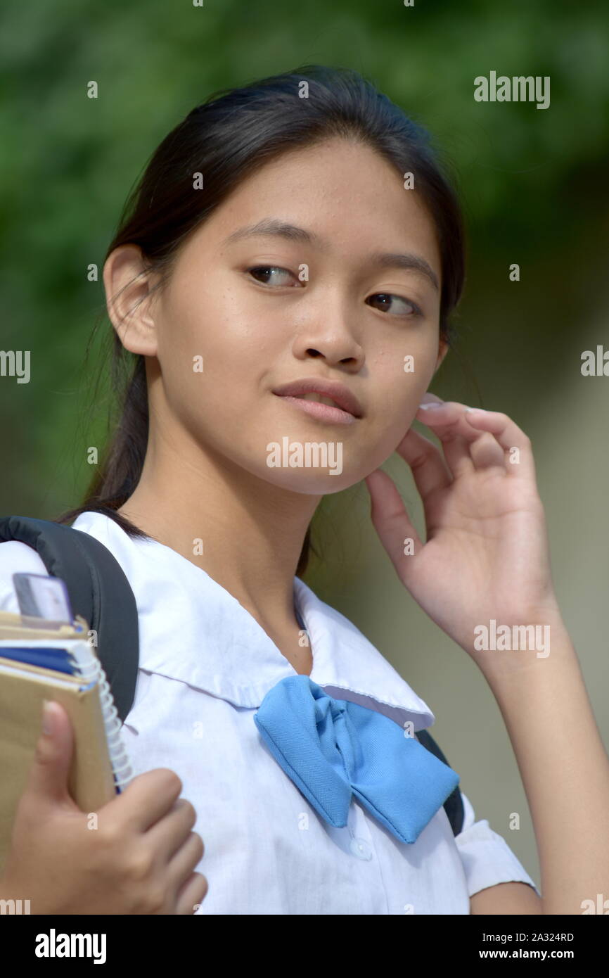A Youthful Asian Girl Student Thinking Stock Photo - Alamy