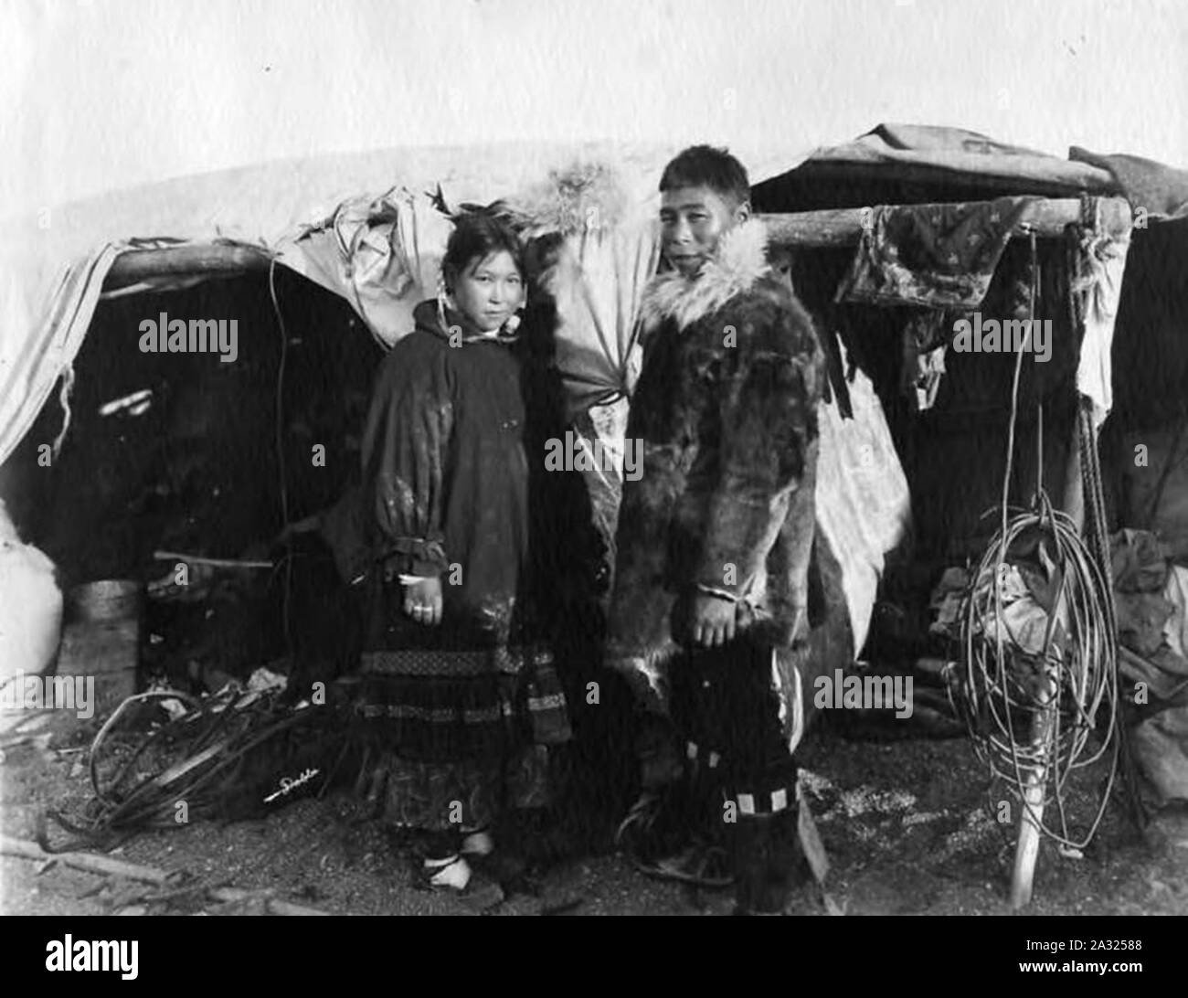 Eskimo couple standing in front of tent shelter Alaska between 1898 and ...