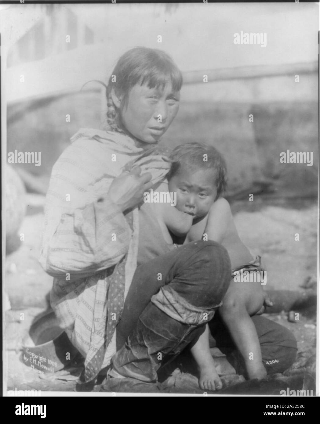 Eskimo and child nursing Stock Photo - Alamy
