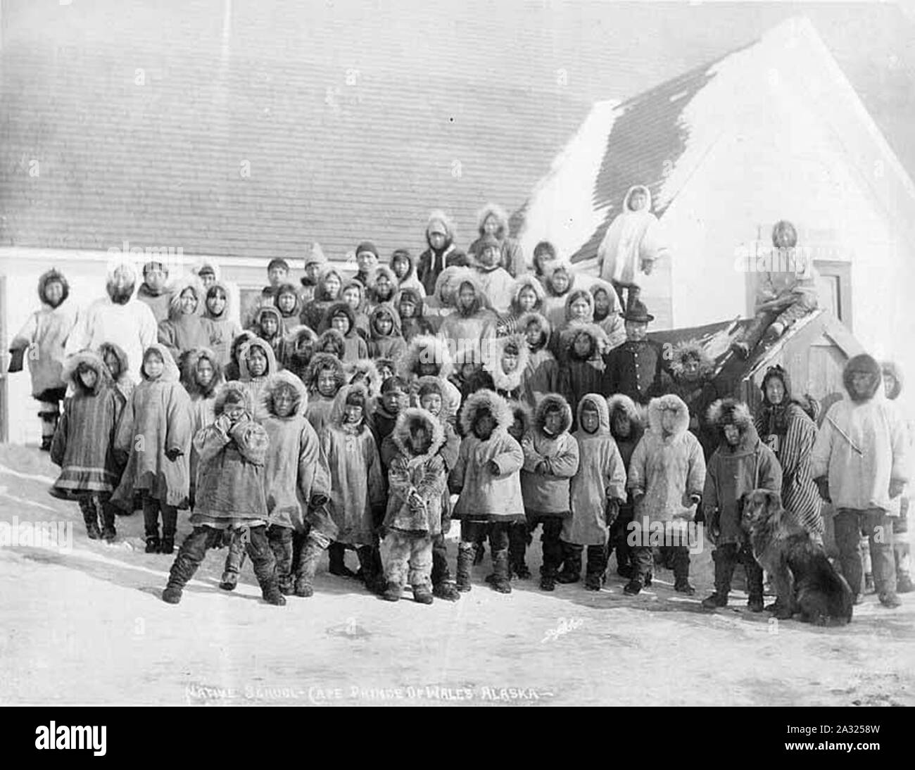 Eskimo children wearing fur parkas posed outside of a school Cape ...