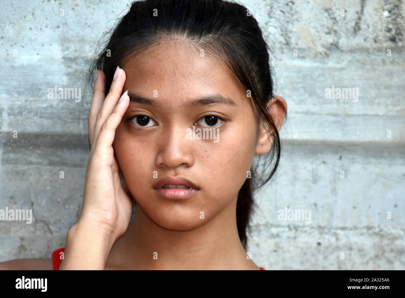 An A Confused Teenager Girl Stock Photo - Alamy