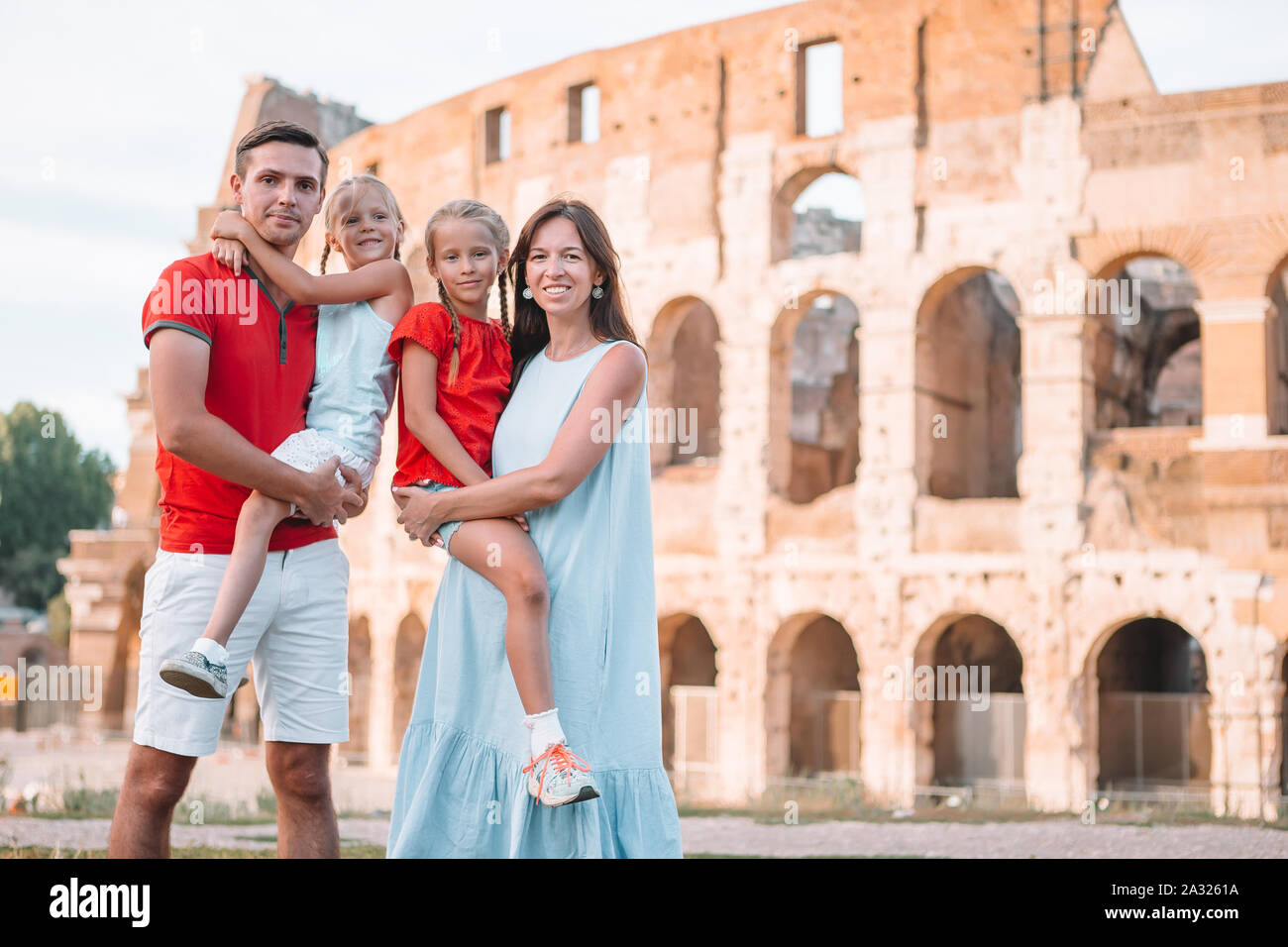 Happy family on roman vacation in Rome over Coliseum background Stock ...