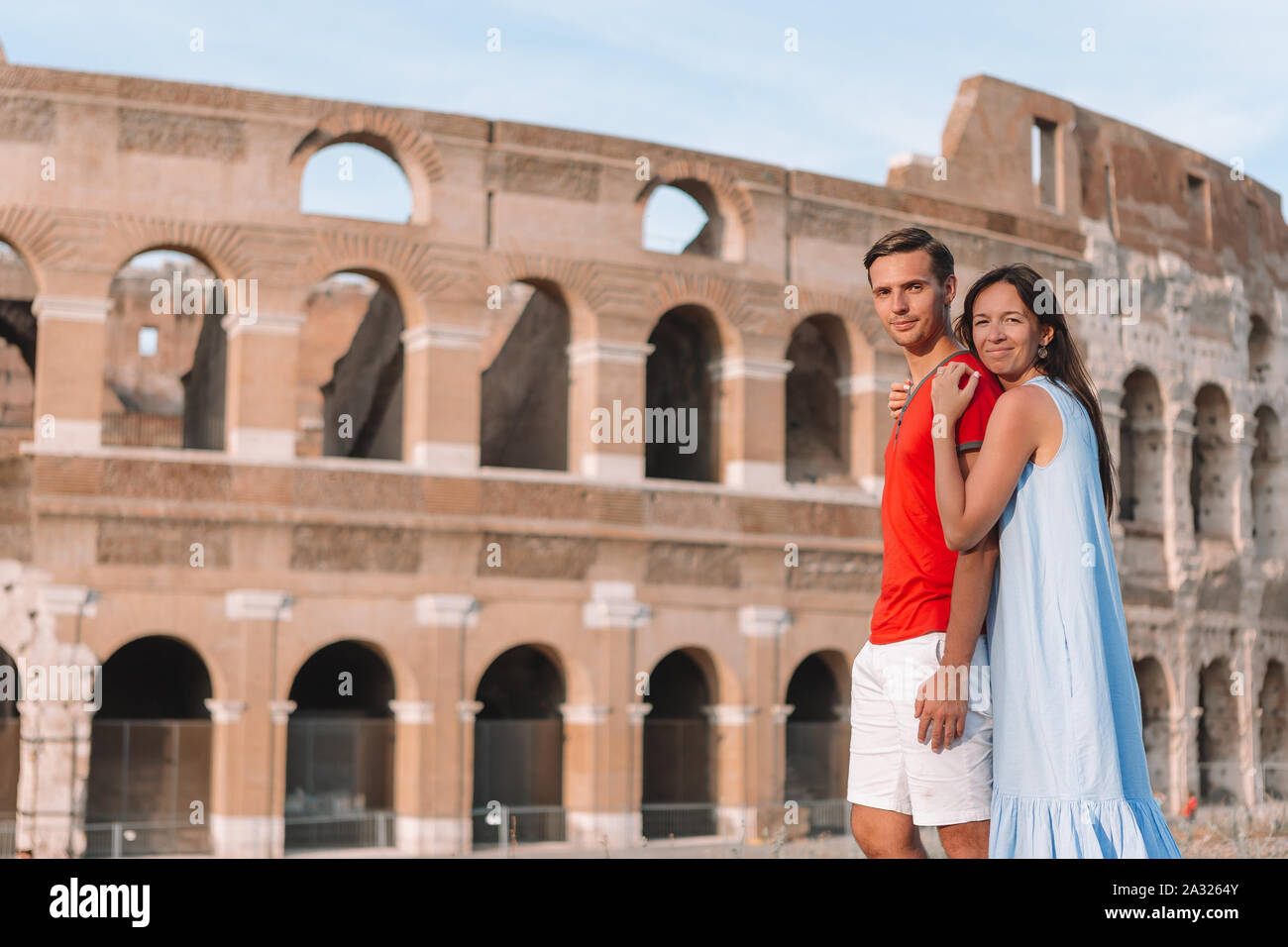 Happy family in Europe. Romantic couple in Rome over Coliseum ...