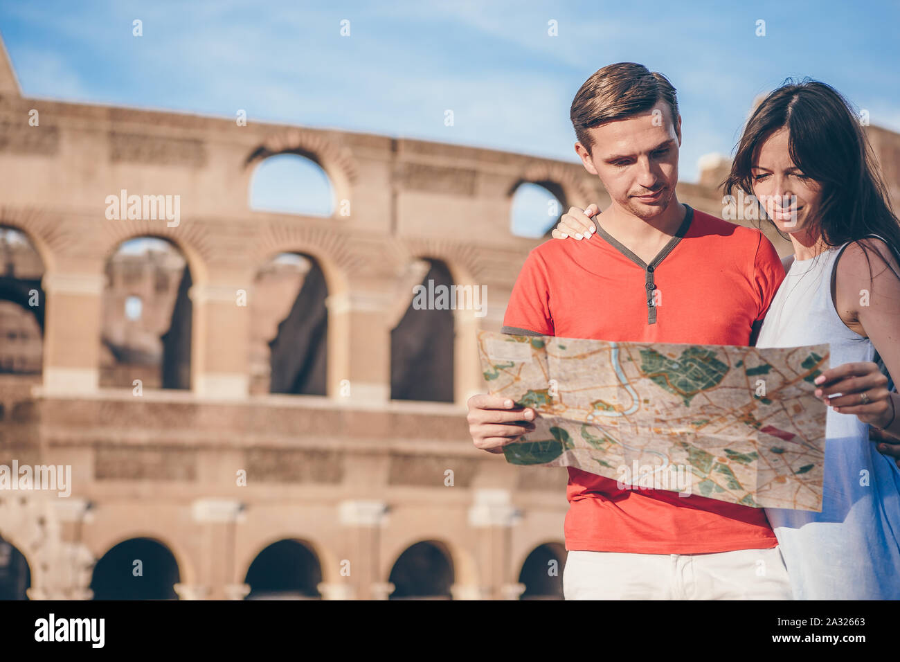 Happy family in Europe. Romantic couple in Rome over Coliseum ...