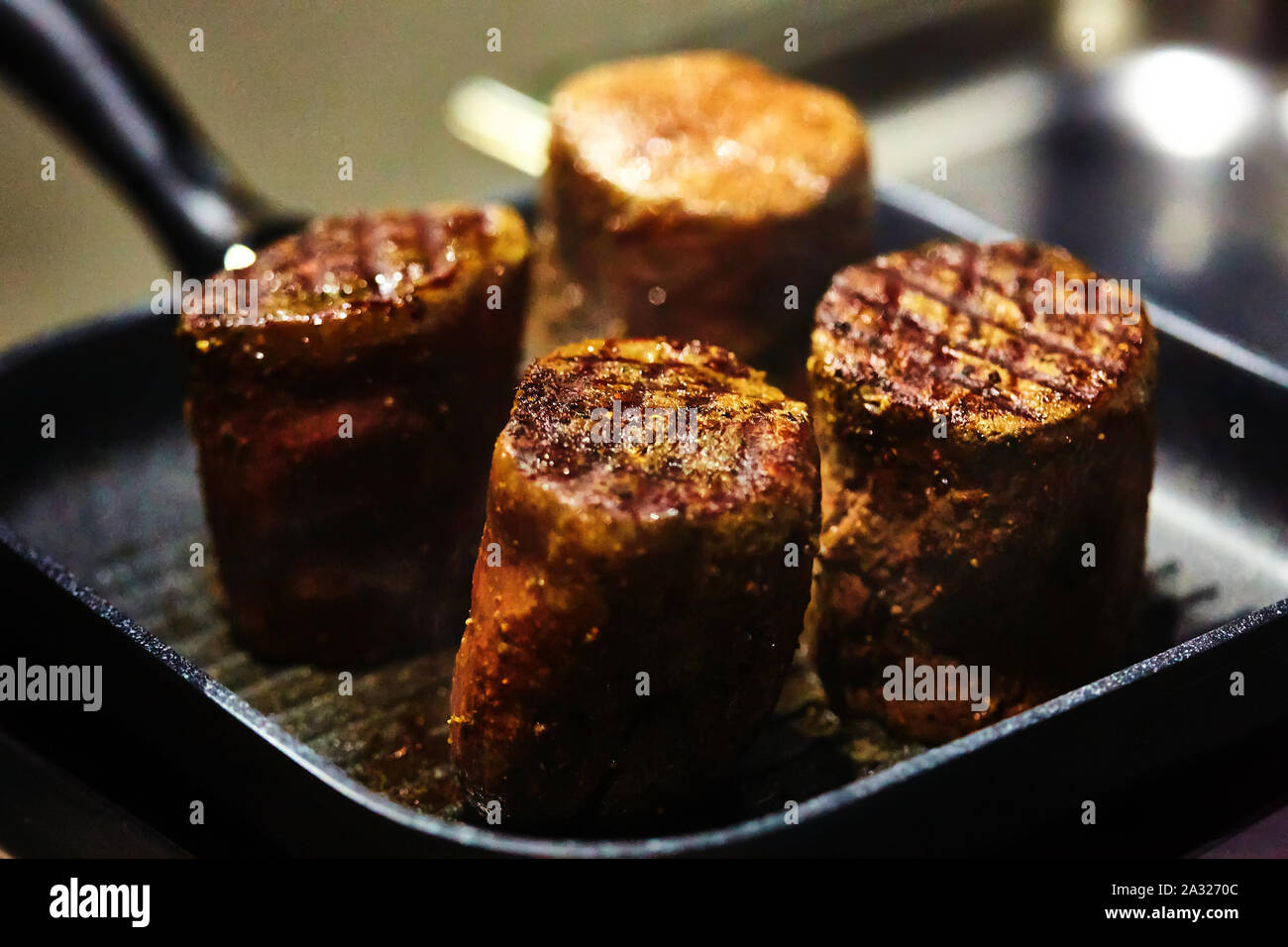 The beef steak in a frying pan. Shallow dof Stock Photo - Alamy