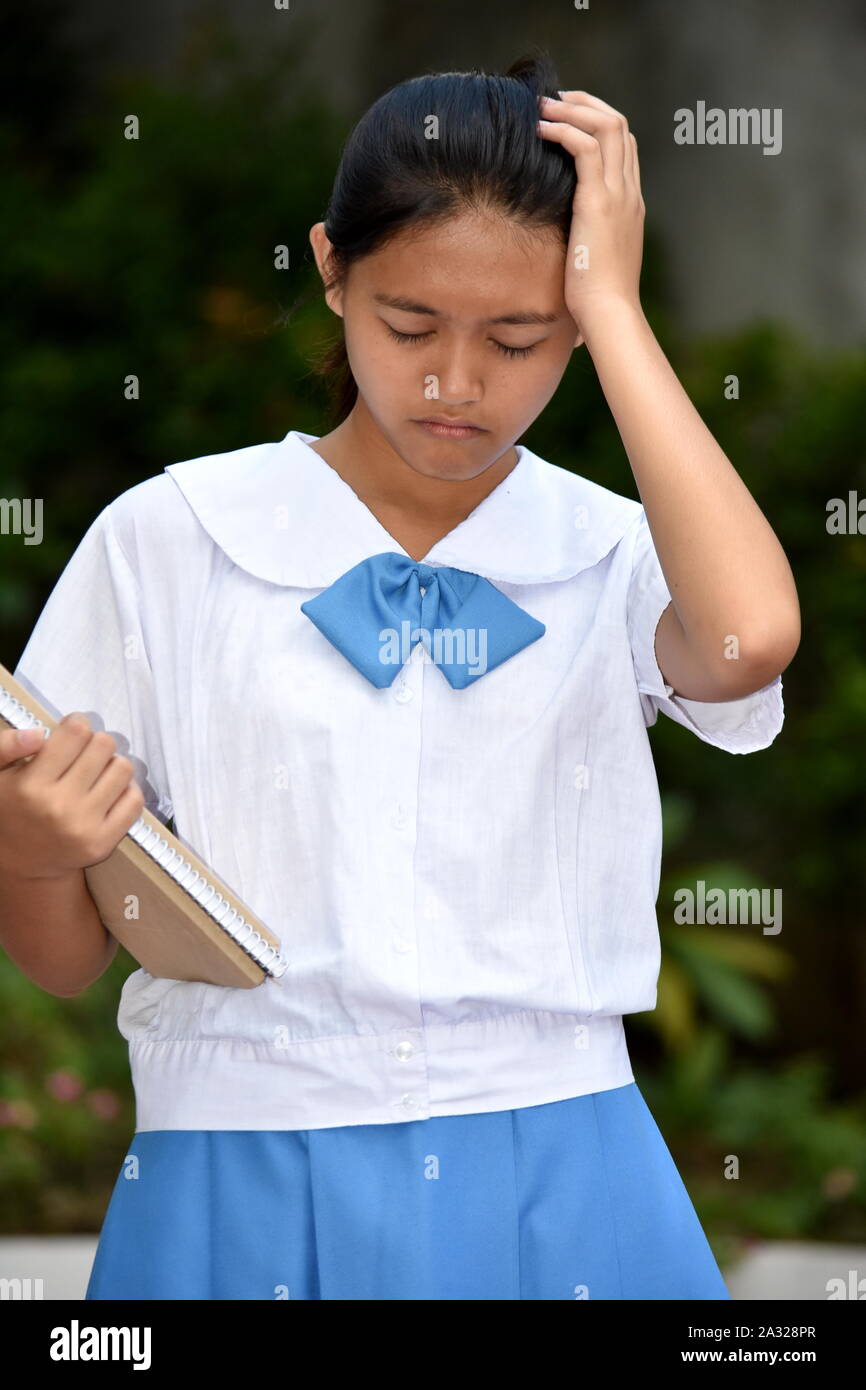 Confused Asian Female Student With School Books Stock Photo - Alamy