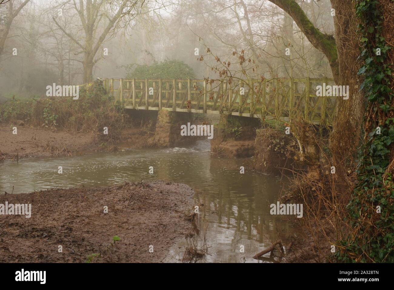 Wooden Footbridge over an Old Mill Leat on the River Exe on a Misty ...