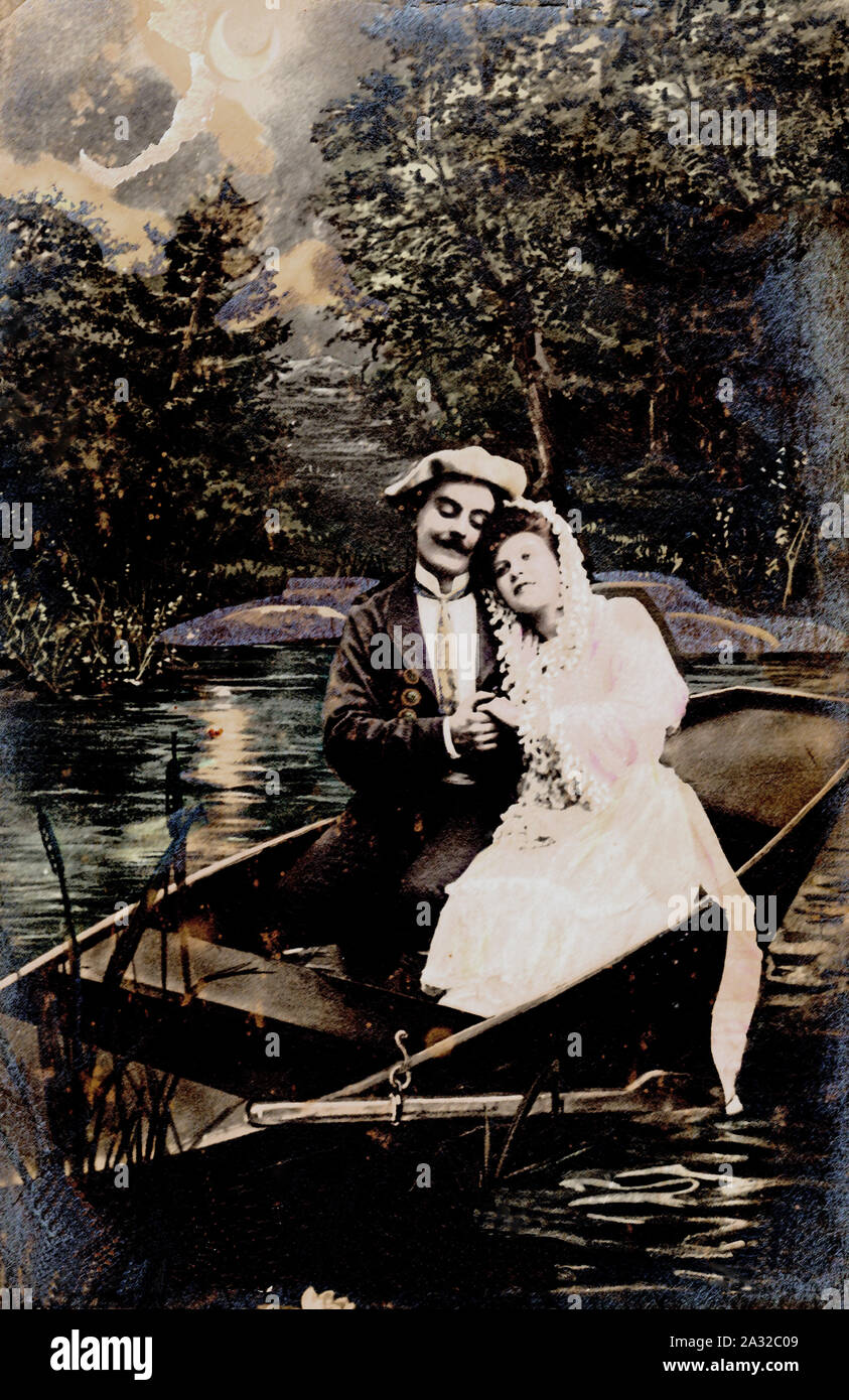 Vintage photograph of a romantic couple in a rowboat, circa 1910 Stock ...