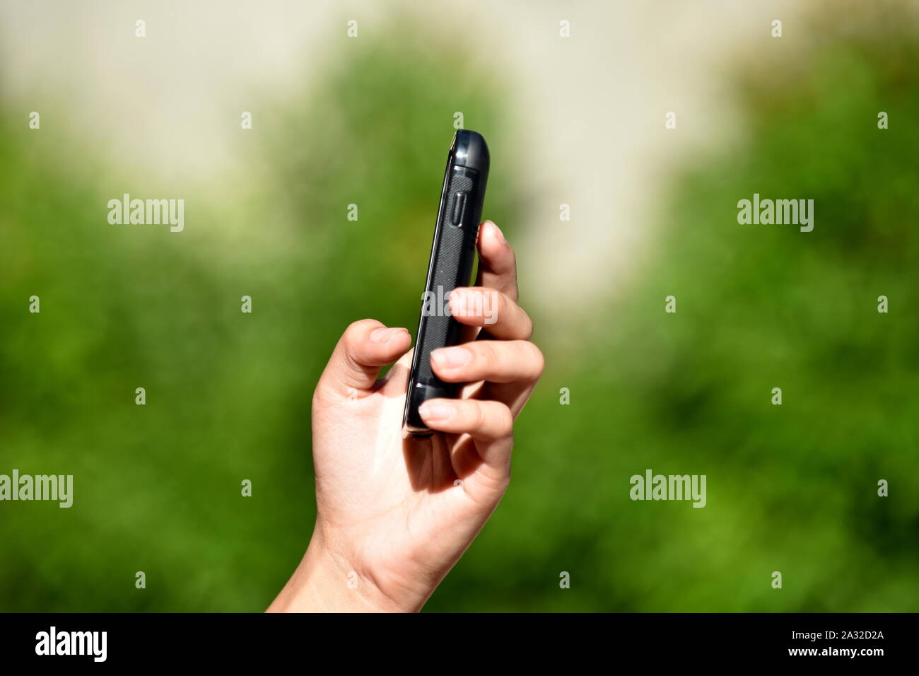 A Hand With Cell Phone Stock Photo - Alamy