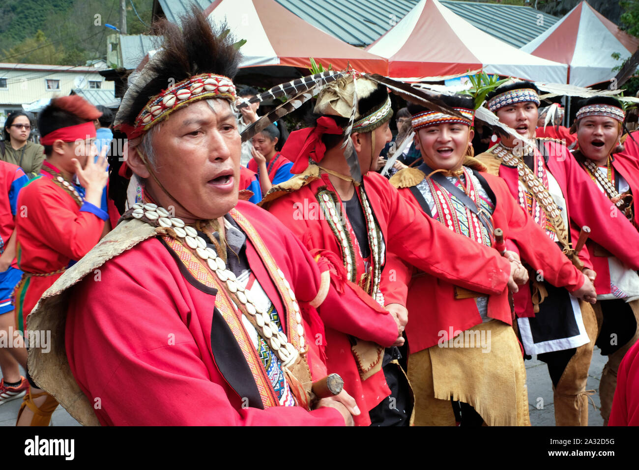 Song and dance celebration of the red and blue-robed Tsou tribe at the ...