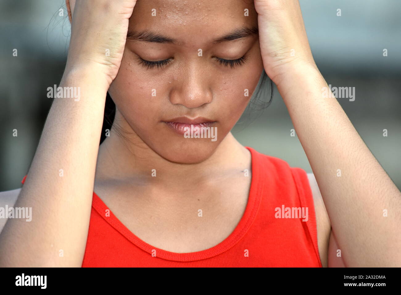 A Youthful Asian Juvenile And Worry Stock Photo - Alamy