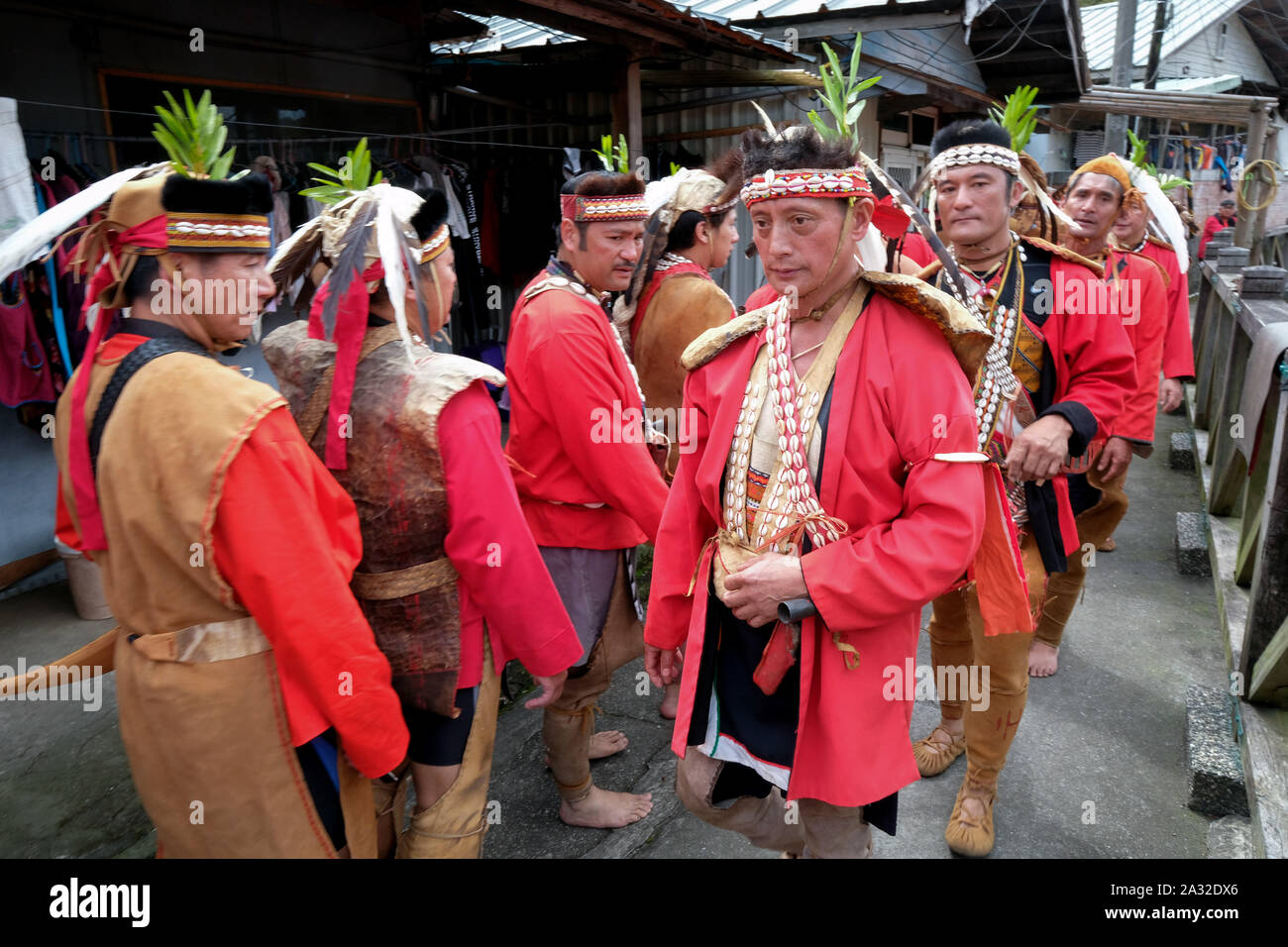 Red-robed Tsou men parade at the Tsou Mayasvi festival in the village ...