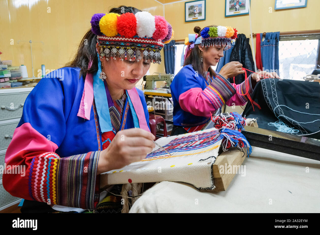 Women from the Tsou tribe tailor the traditional tribal dresses in ...