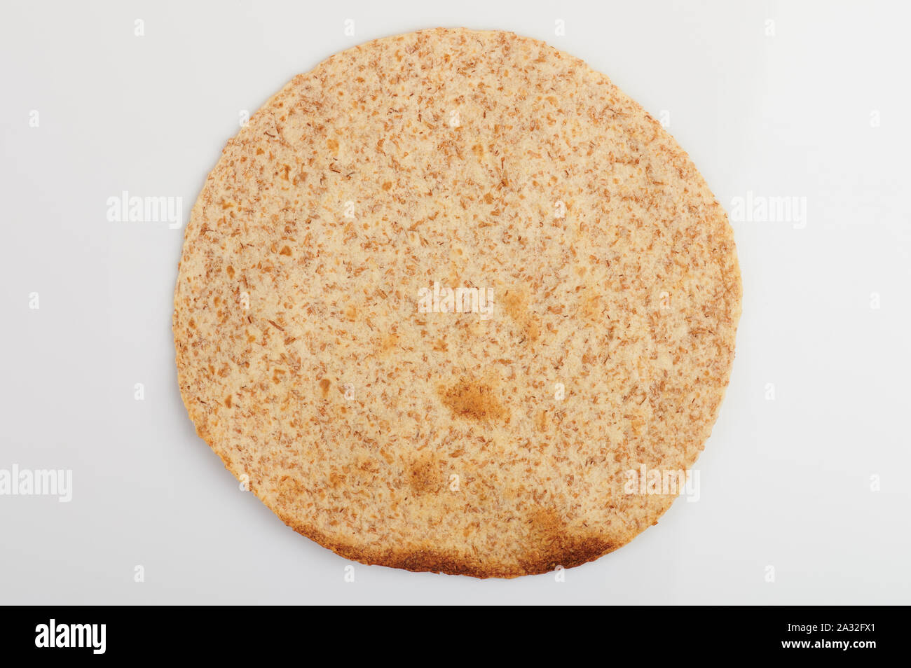 One toasted tortilla top view isolated on white background Stock Photo ...
