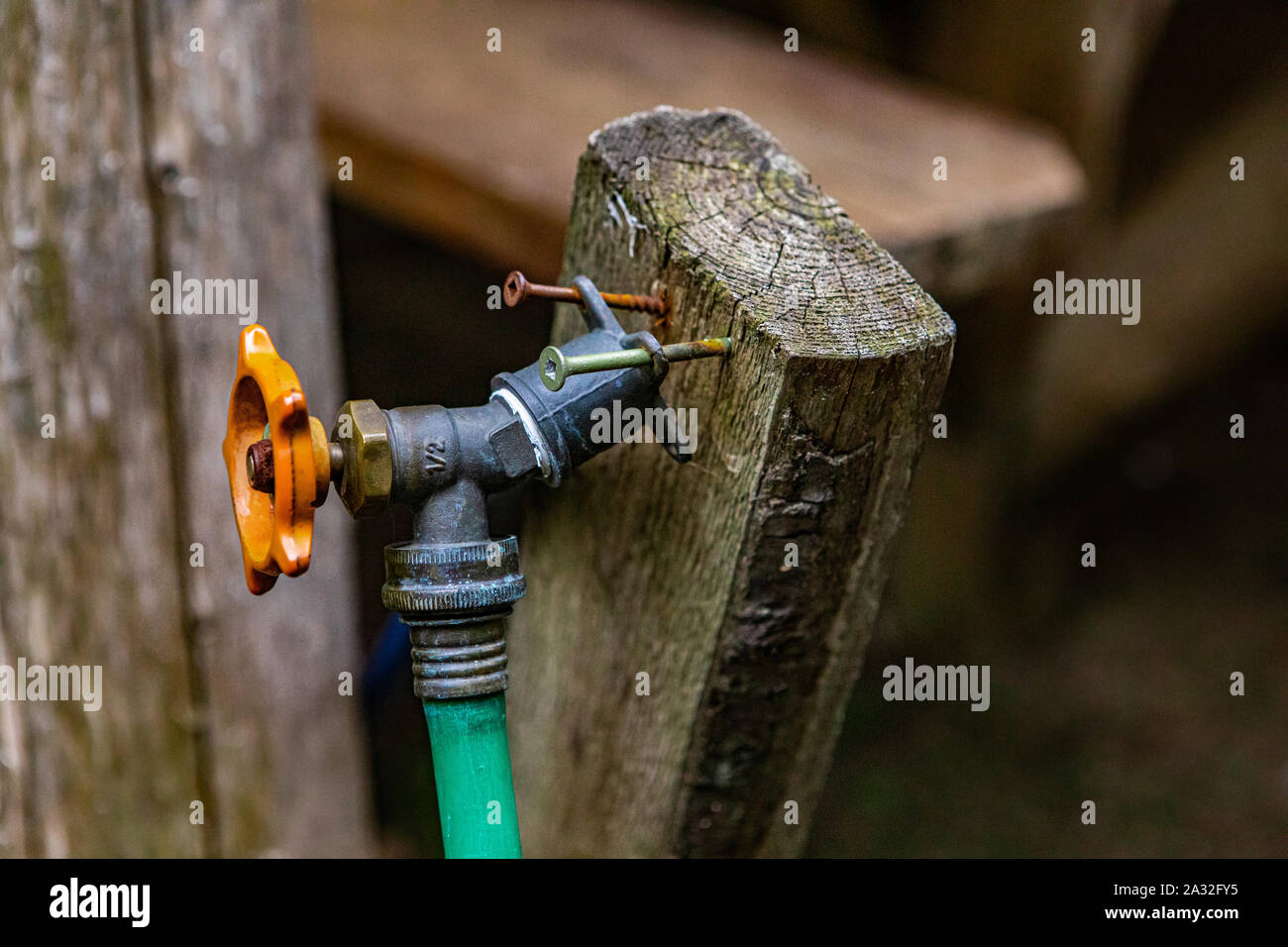 Hose attached to spigot hi-res stock photography and images - Alamy