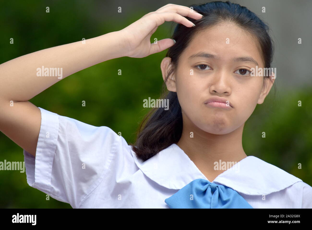 A Confused Young Filipina Person Stock Photo - Alamy