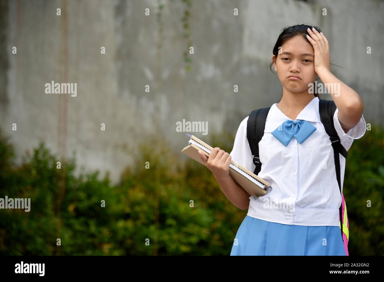 Youthful Asian Girl Student And Confusion Stock Photo - Alamy
