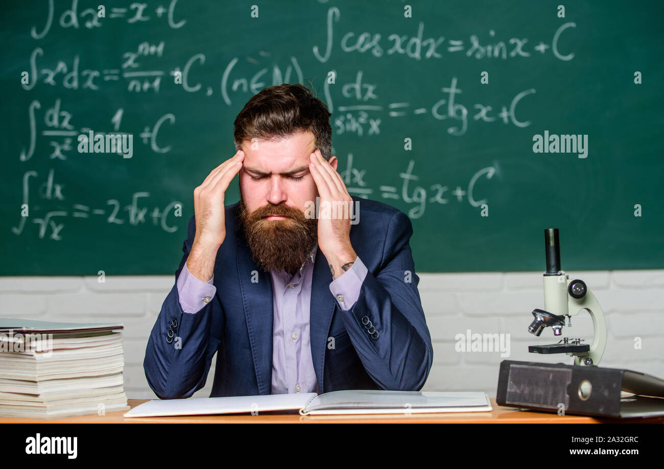 Terrible headache. Teacher has headache. Bearded man suffer from ...