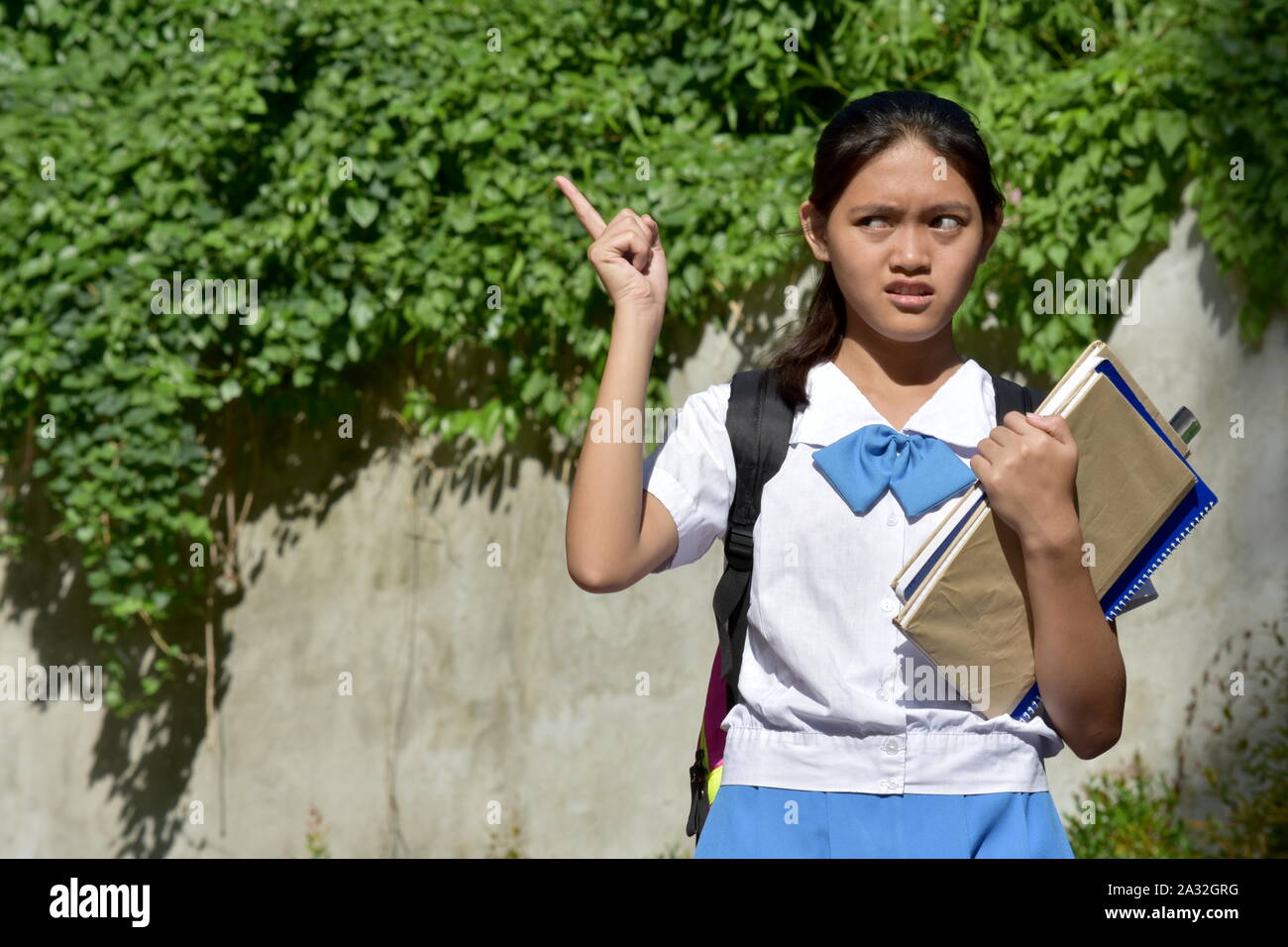 An A Diverse Girl Student Pointing Stock Photo - Alamy