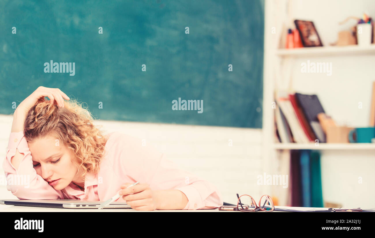 Exhausted teacher in classroom hi-res stock photography and images - Alamy