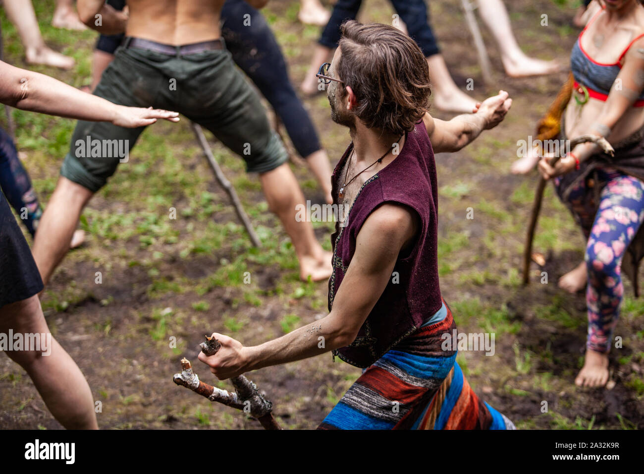 A colorful guy is seen from the side practicing ancient cultural ...