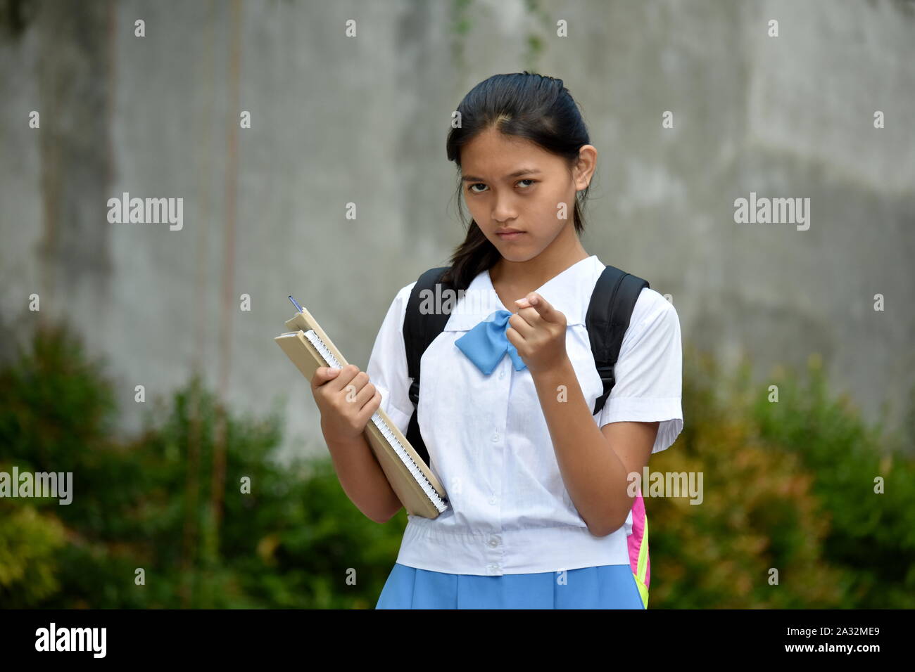A Cute Minority Female Student Pointing Stock Photo - Alamy