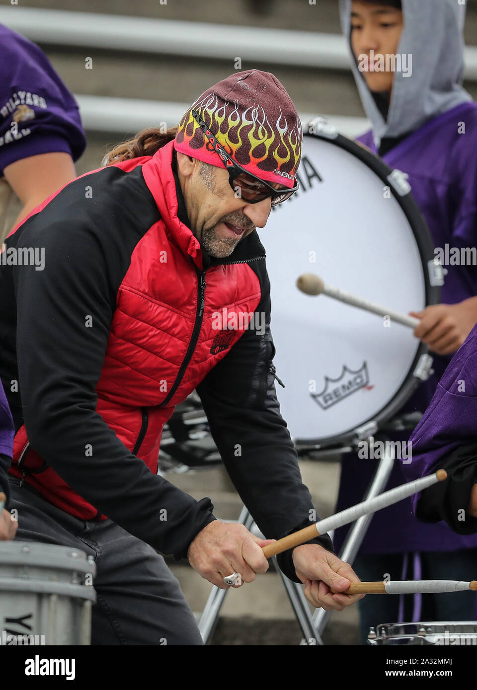 Cheerleaders and dancers from Rogers High School performing at half ...