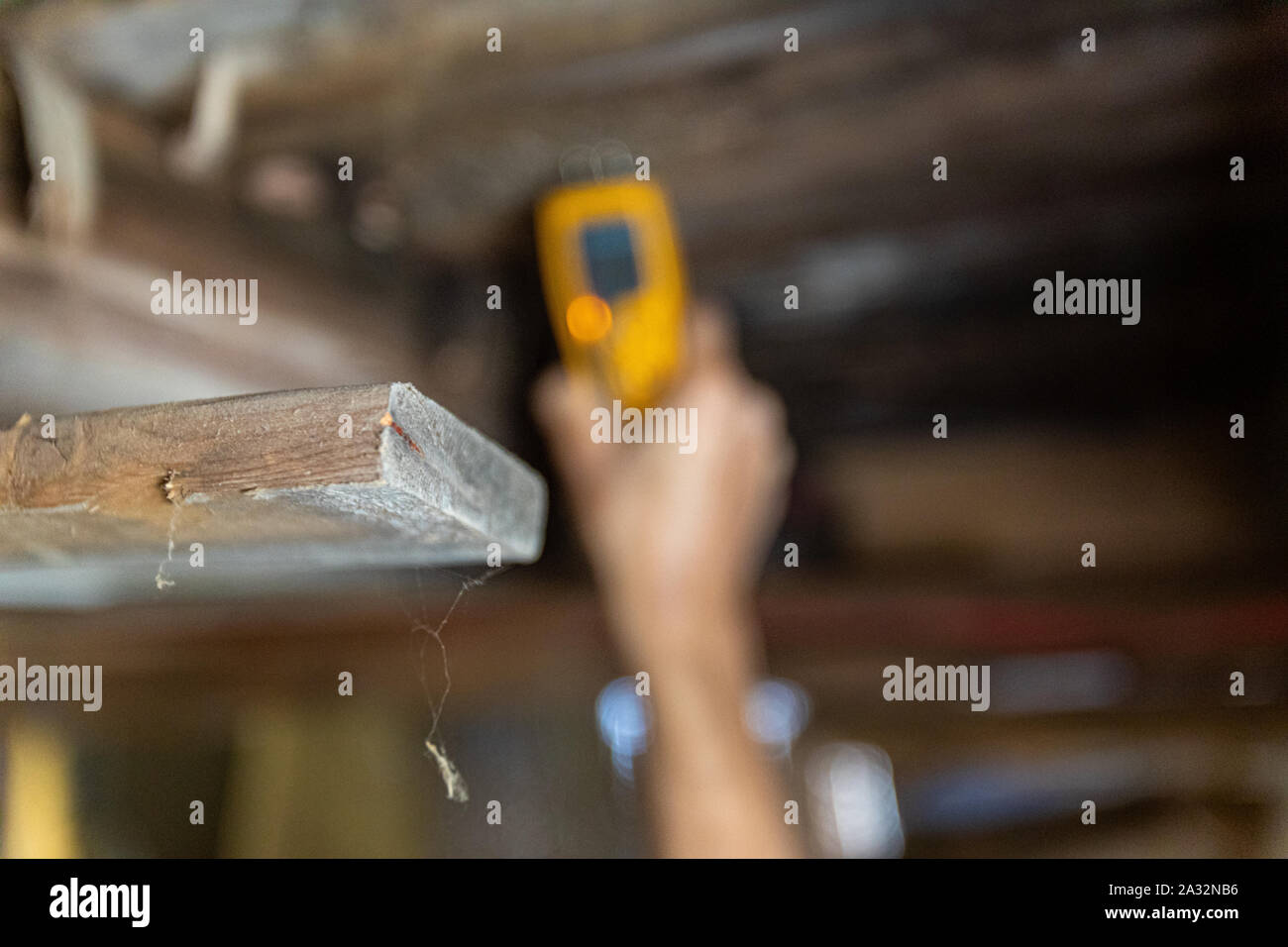 A close up view on an old and dusty timber plank inside a house, a ...