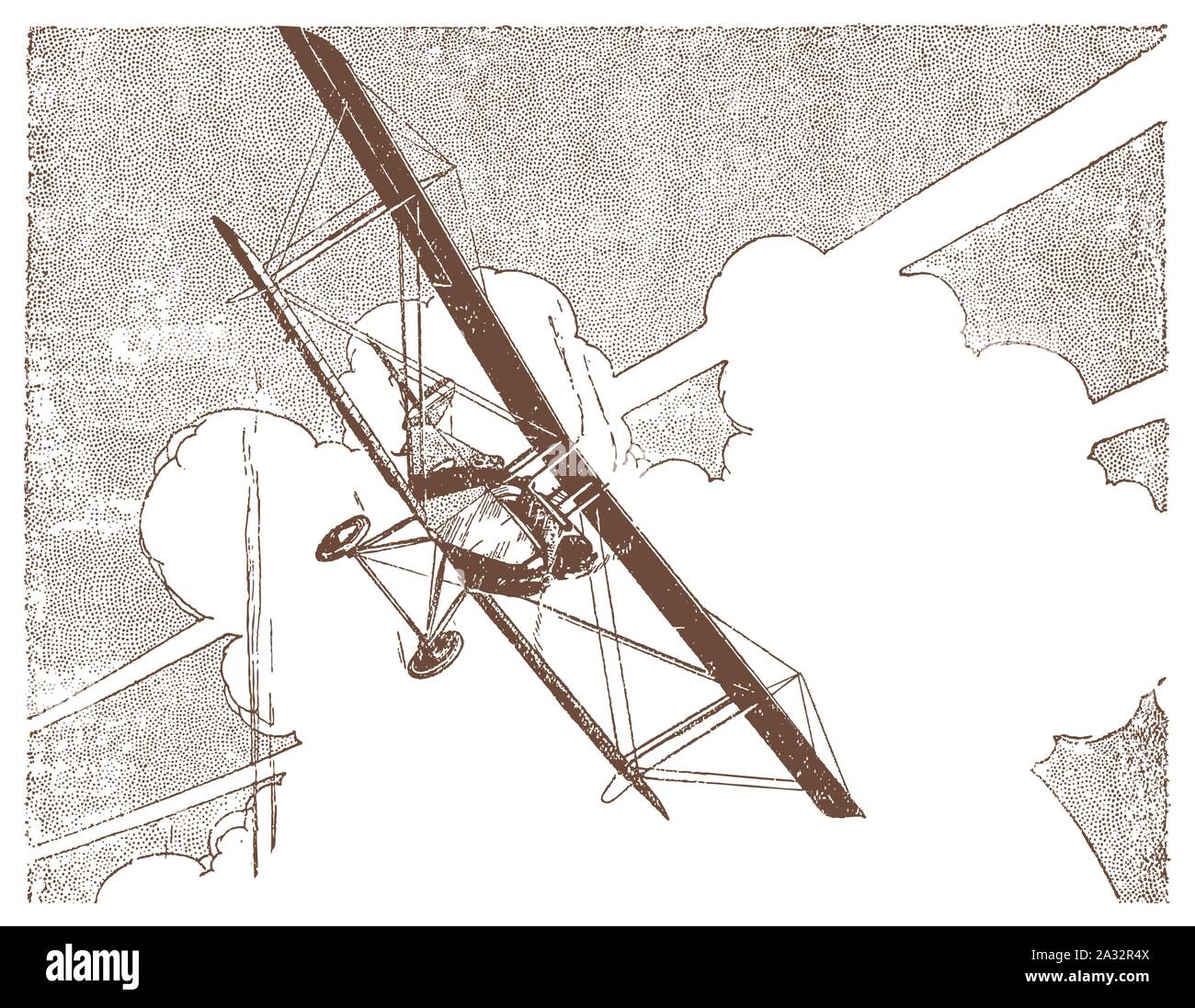 Rolling historic biplane in fromt of a cloudy and sunny sky ...