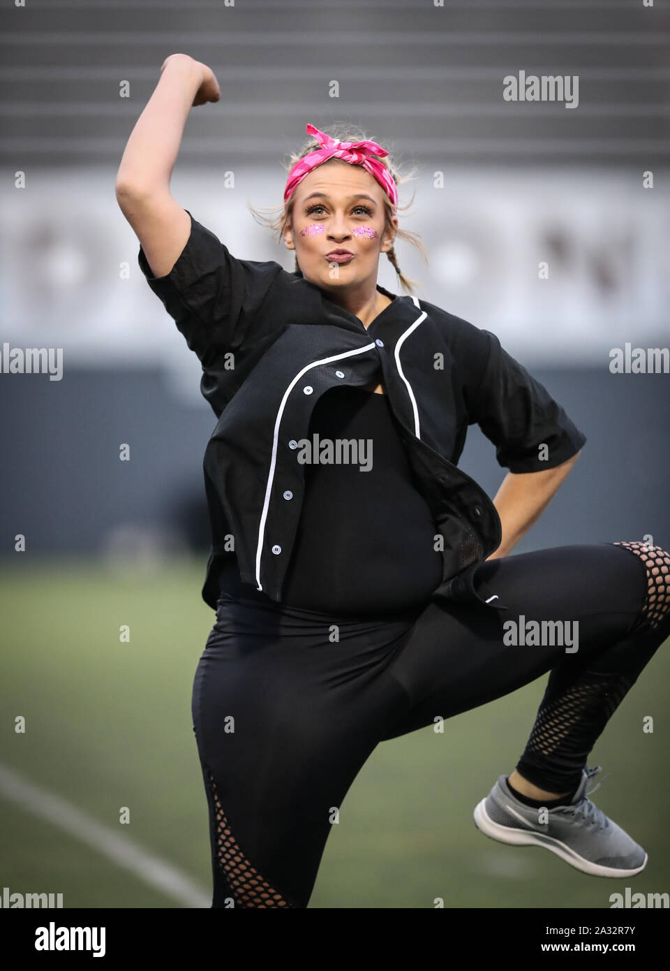 Cheerleaders and dancers from Rogers High School performing at half ...