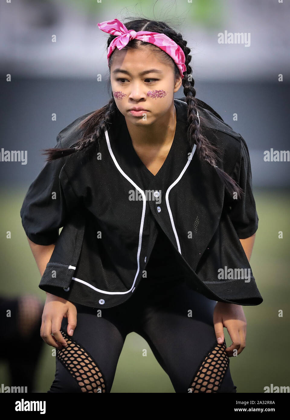 Cheerleaders and dancers from Rogers High School performing at half ...