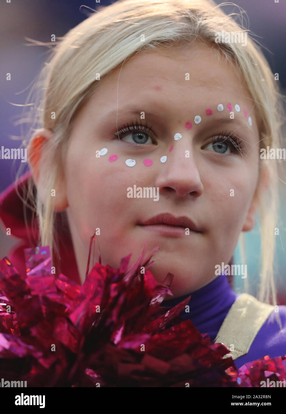 Cheerleaders and dancers from Rogers High School performing at half ...