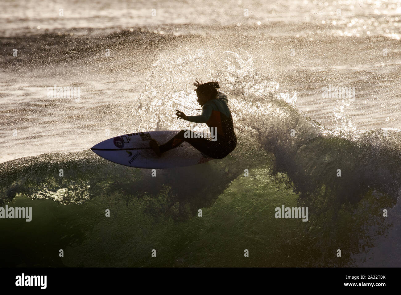 Surf board rider on wave Stock Photo - Alamy