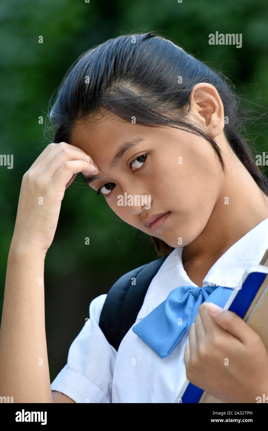 An Unhappy Youthful Filipina Girl Student Stock Photo - Alamy
