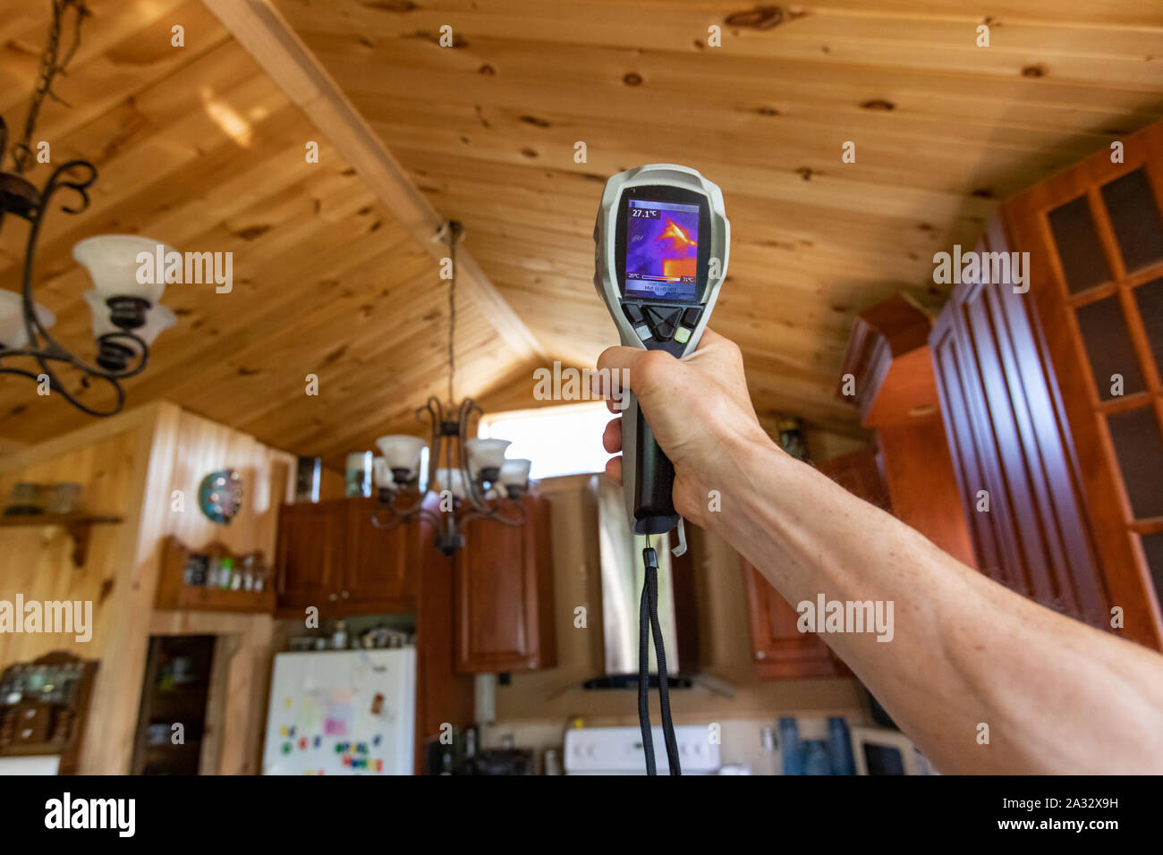 A first person perspective of a man pointing an infrared thermal ...
