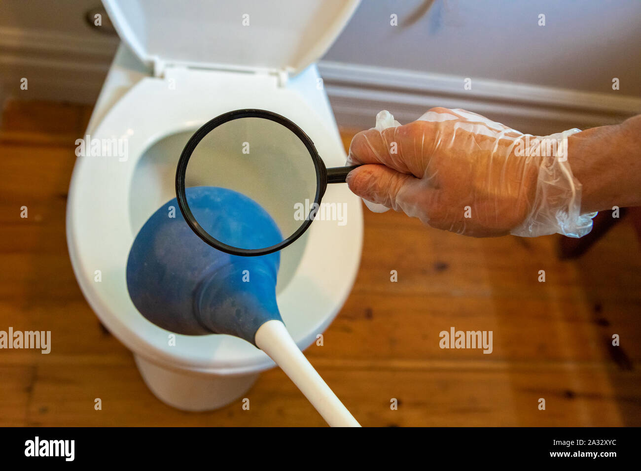 A closeup & first person perspective of a repairman holding a ...