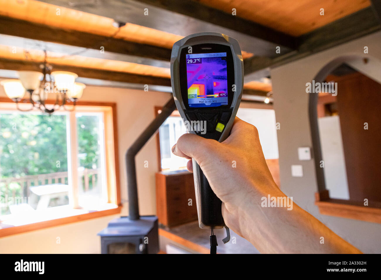 A first person perspective holding an infrared thermal vision device ...