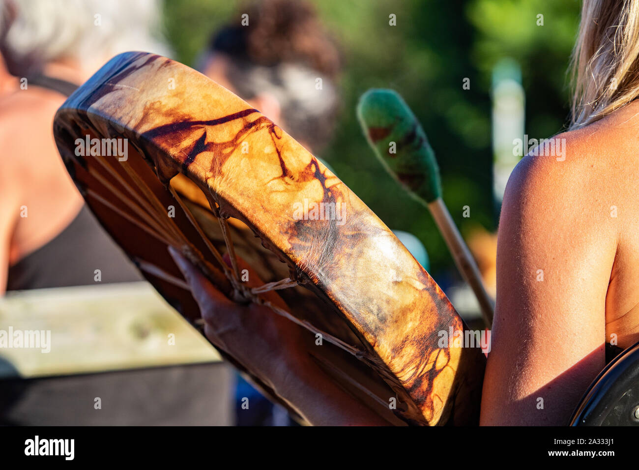 A colorful leather drum in Native American style is seen close up and ...