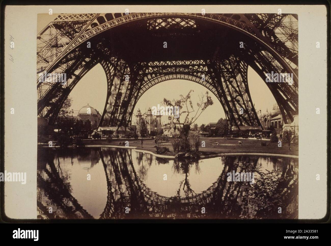 Exhibit buildings and grounds seen through the lower part of the Eiffel ...