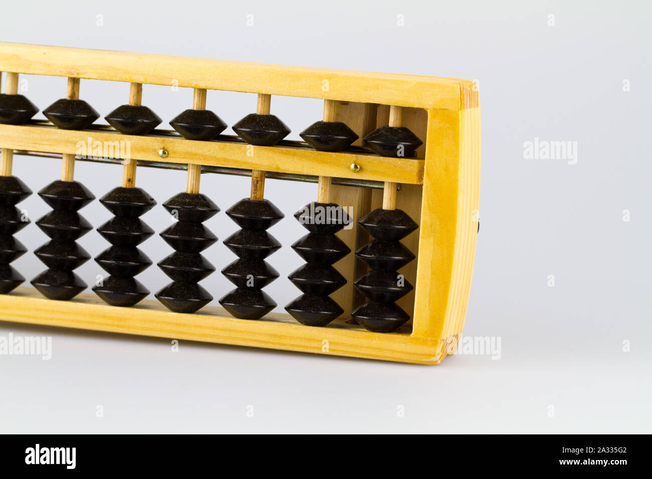 abacus with black beads on black reflective surface Stock Photo - Alamy