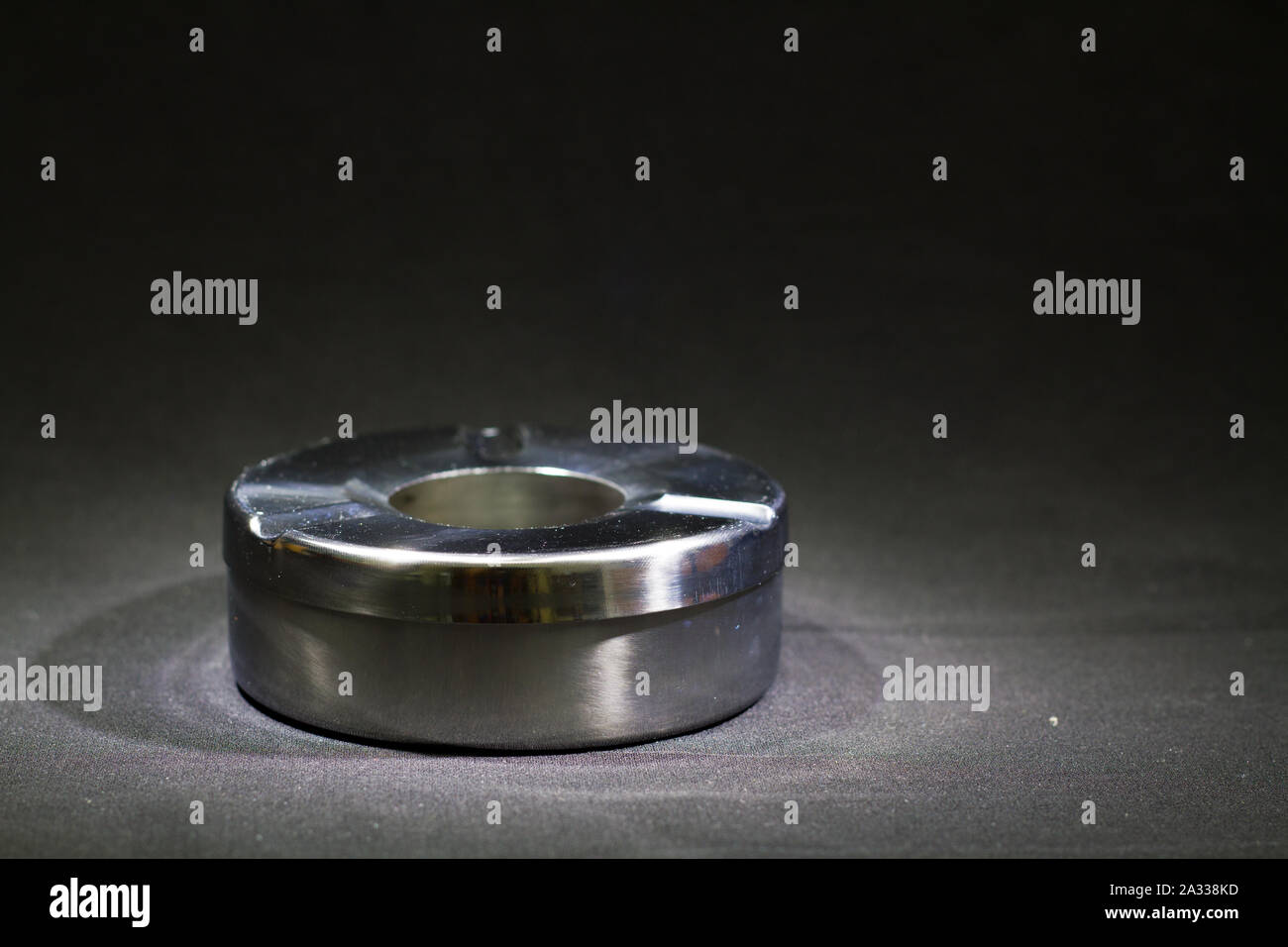 cigarette ashtray with dark background Stock Photo - Alamy