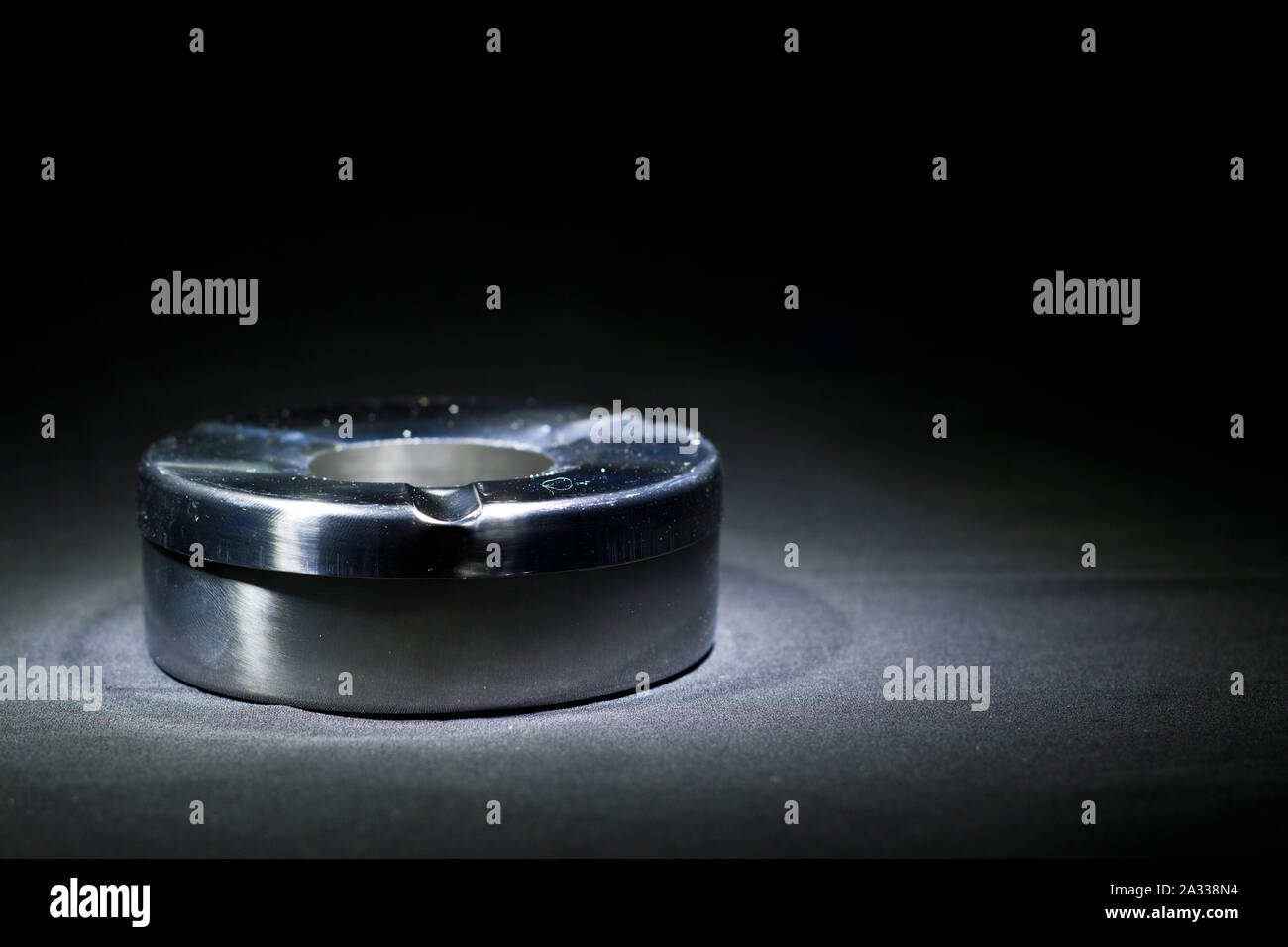 cigarette ashtray with dark background Stock Photo - Alamy