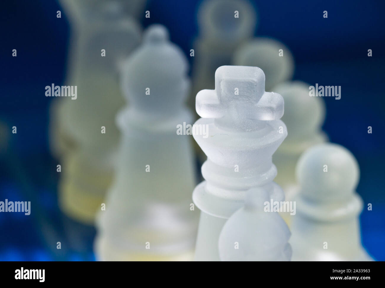 decorative glass chess set back-lighted with dark background Stock ...