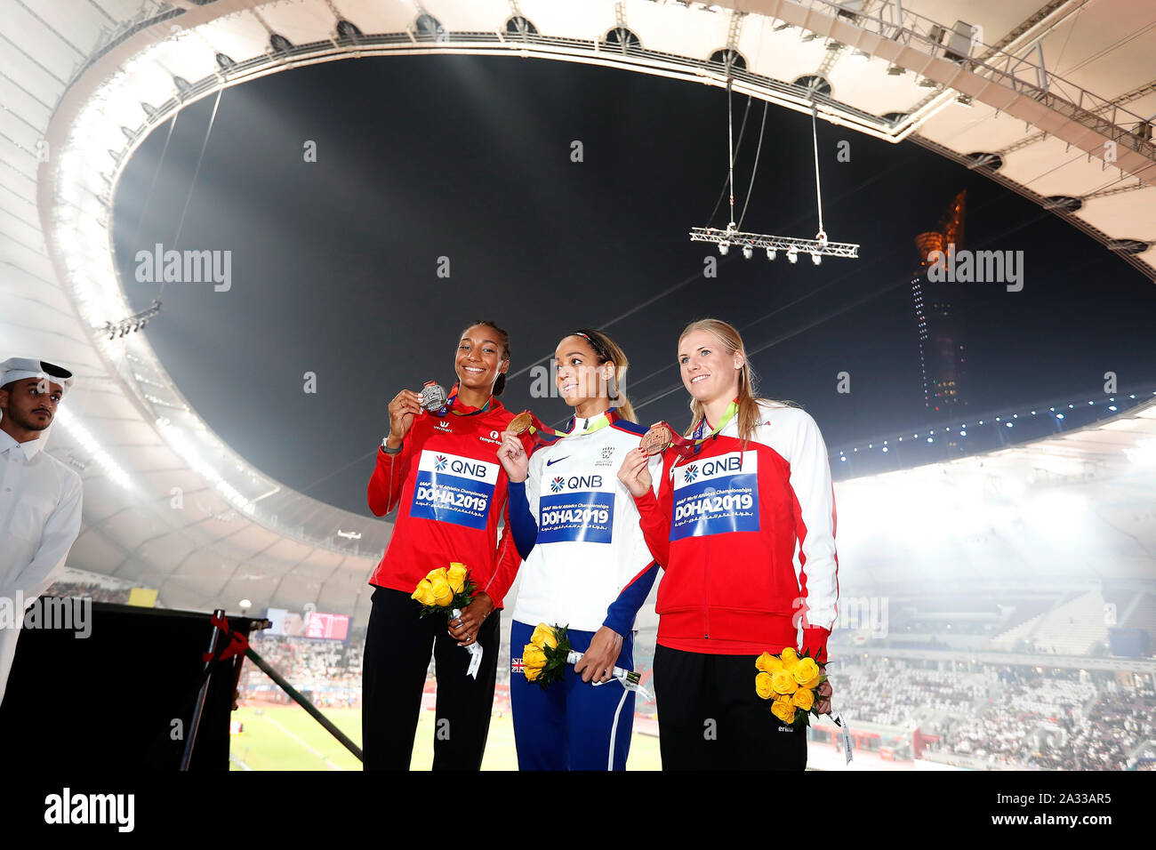 Doha, Qatar. 4th Oct, 2019. Gold medalist Katarina Johnson-Thompson (C ...