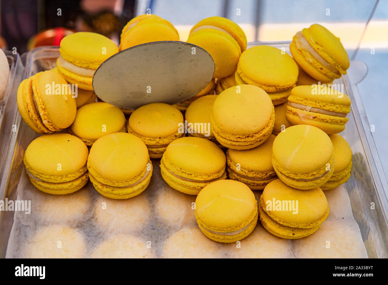 Lemon flavored yellow macarons (French macaroons) are seen up-close ...