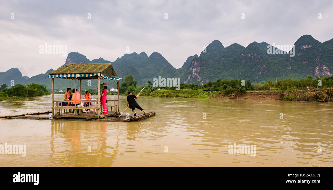 Yangshuo, China, 20 Jun 2014: Traditional wooden raft sailing down Li ...